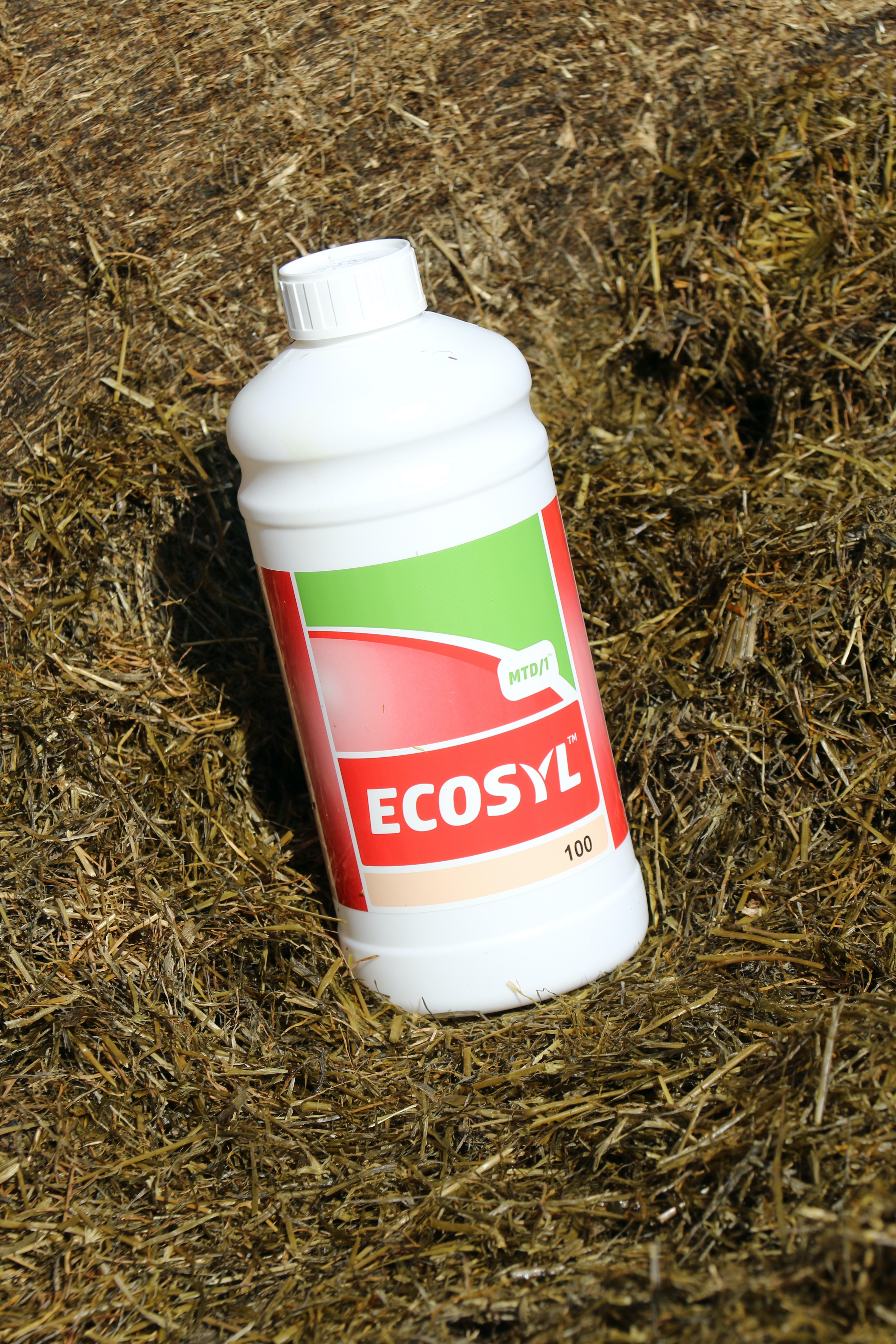 Treating grass silage with an additive